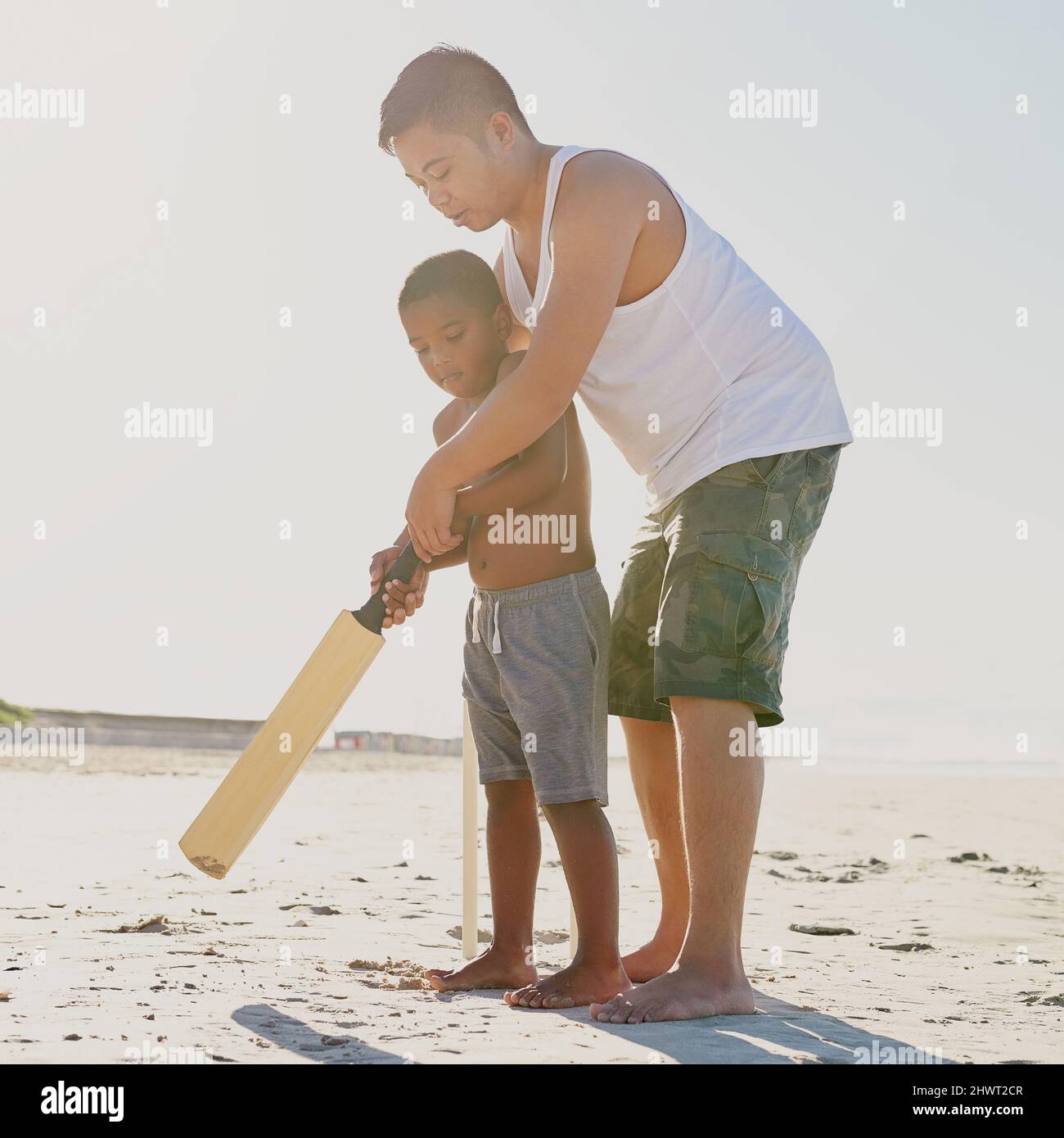 Father son playing cricket on hi-res stock photography and images - Alamy