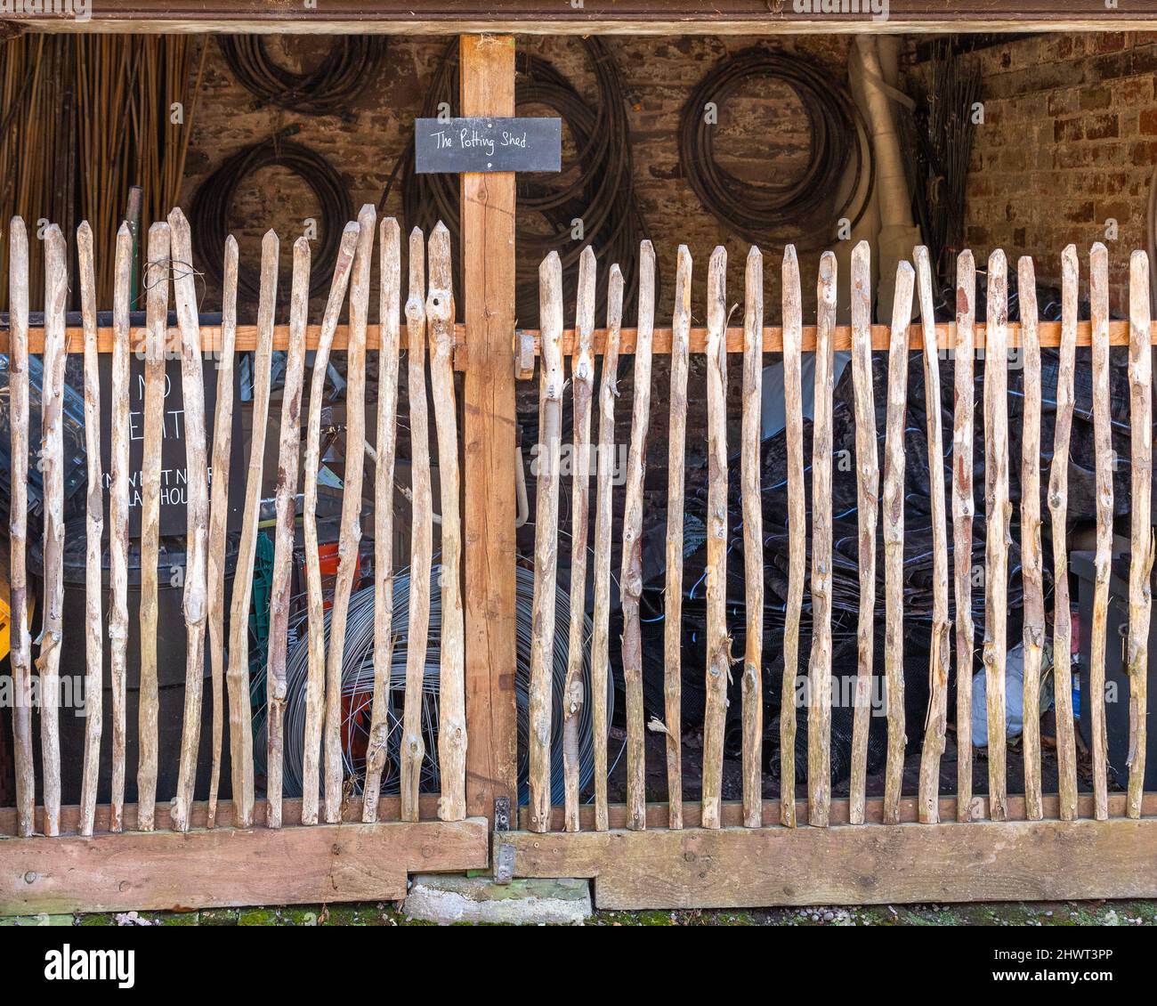 The Potting Shed lean to timber structure with rough paling fence ...