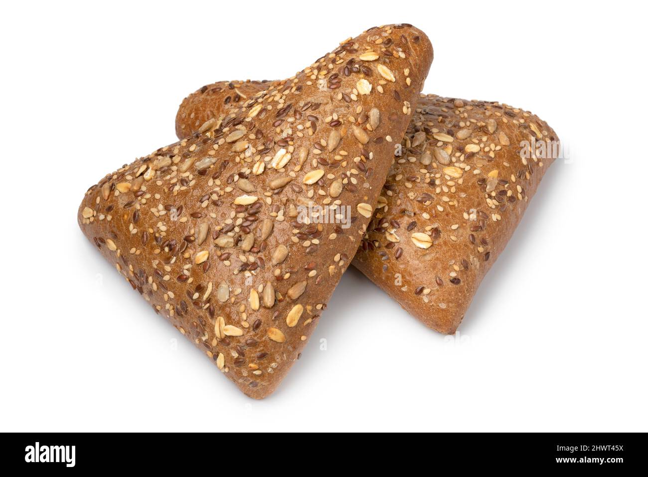 Pair of fresh multi grain triangle buns close up isolated on white ...