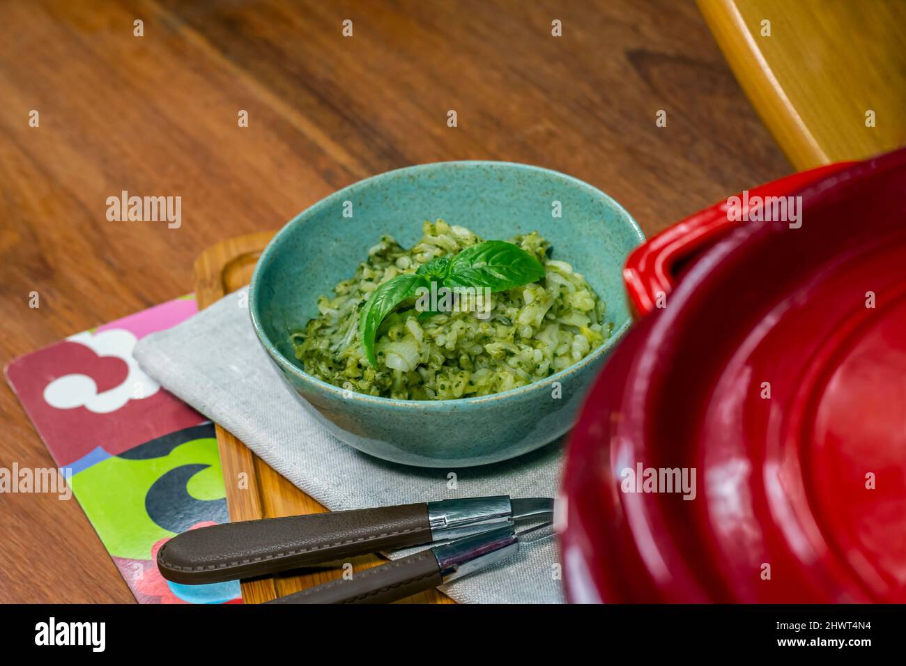 Traditional Italian risotto on the red rustic pan Stock Photo - Alamy