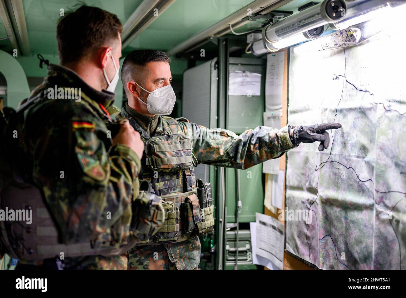 Wildflecken, Germany. 07th Mar, 2022. Two soldiers sift through a map ...