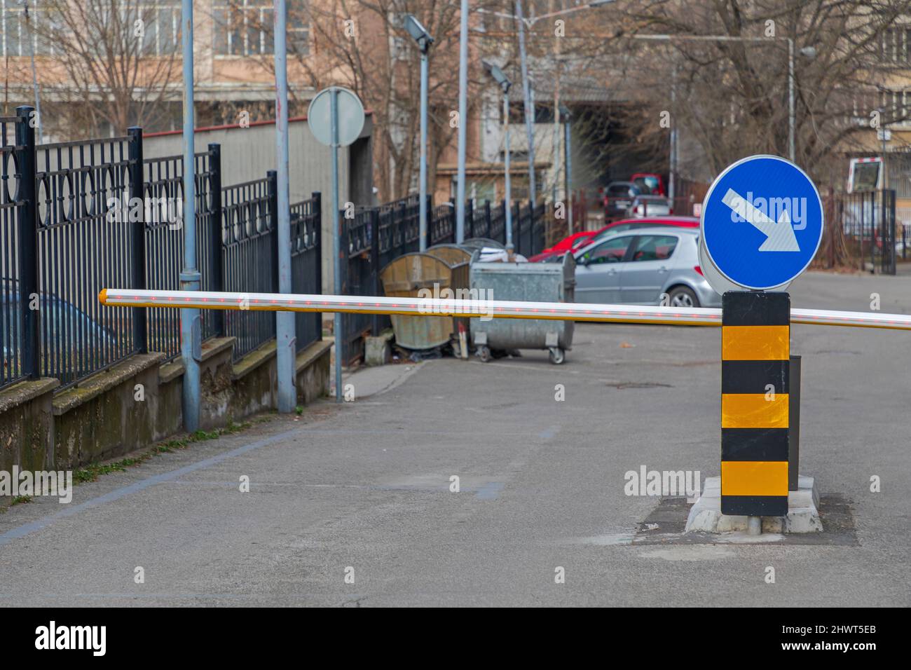 Parking Ramp Barrier Boom and Direction Arrow Sign Stock Photo - Alamy