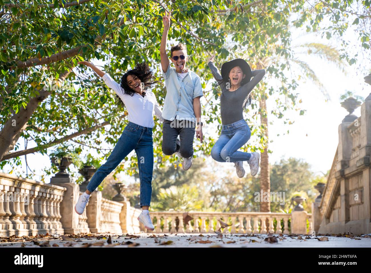 Multiracial students playing in park hi-res stock photography and ...