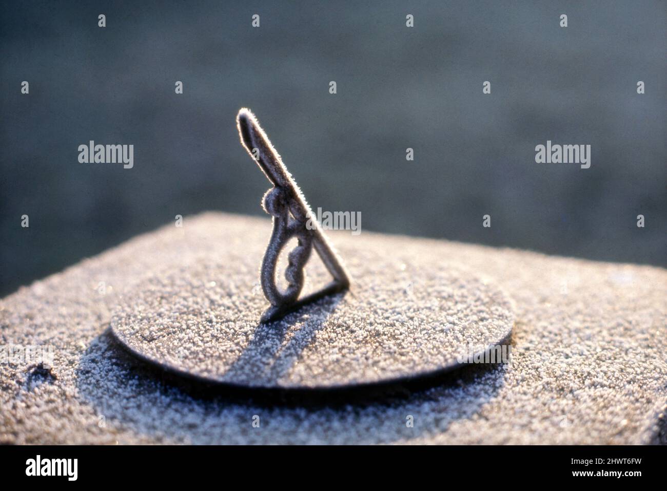 Sundial covered in frost after a cold night Stock Photo - Alamy