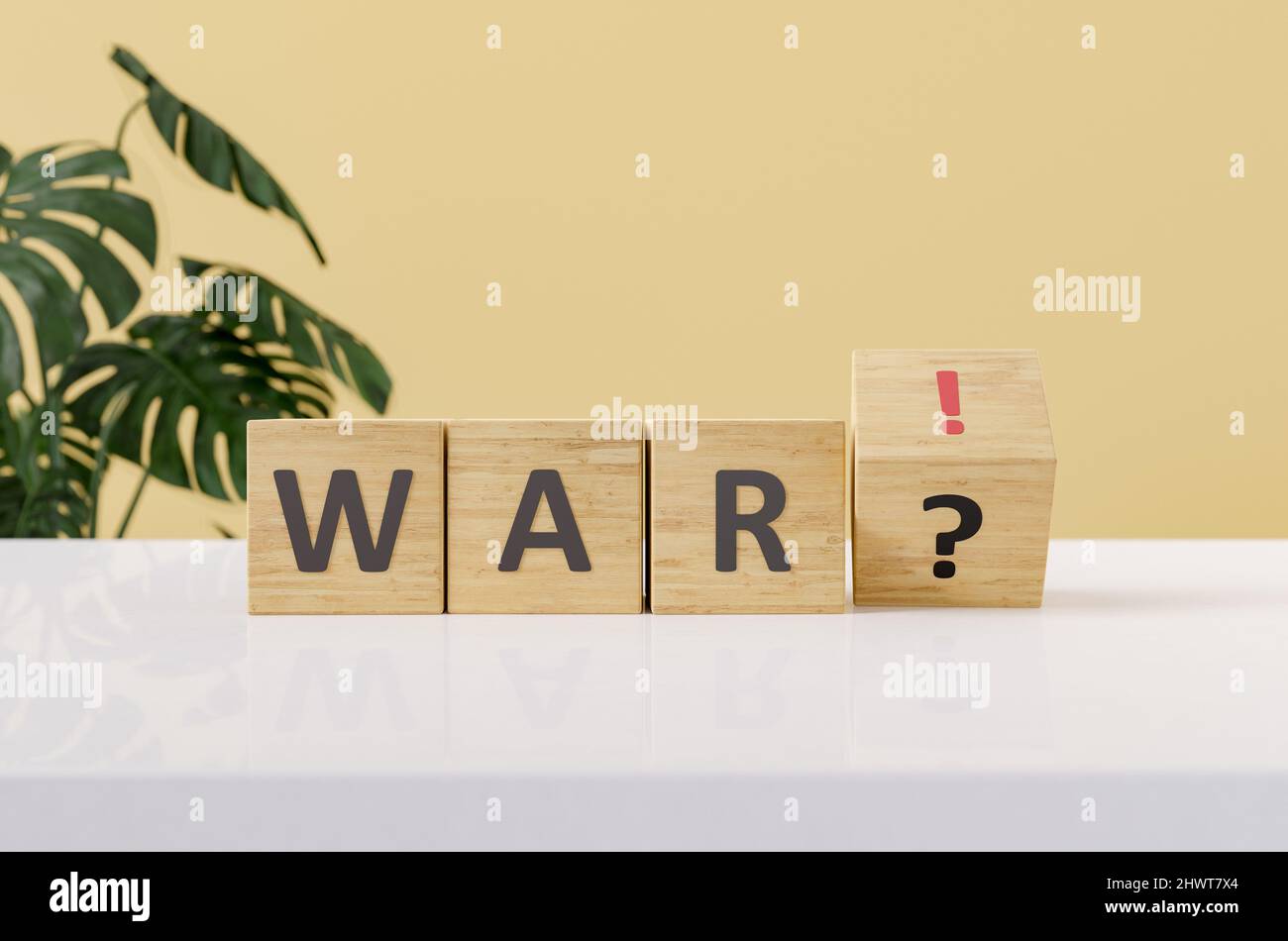 cubes of letters with the word WAR with exclamation mark and question ...