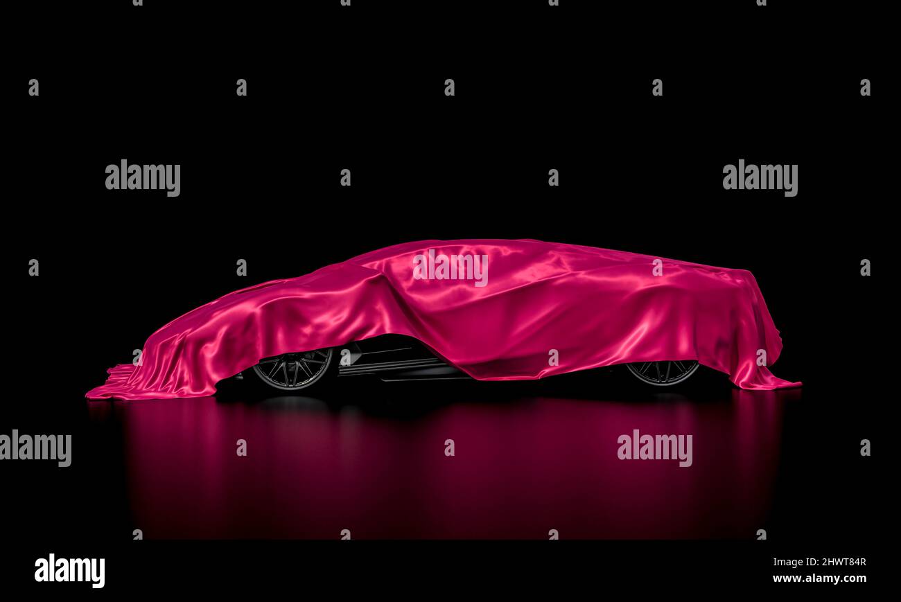 sports car hidden by a red blanket on a black background. profile view ...