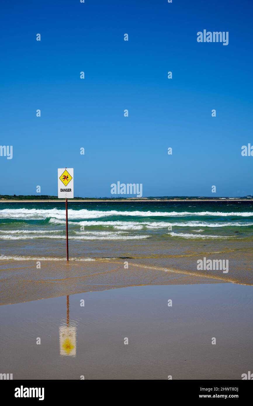 Yellow beach closed sign Stock Photo - Alamy
