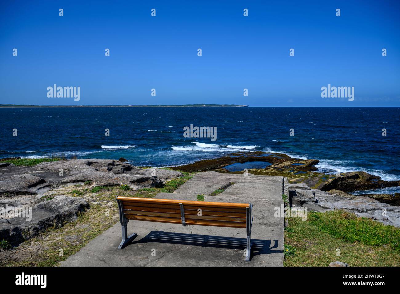 Outdoor bench looking out over the ocean Stock Photo - Alamy