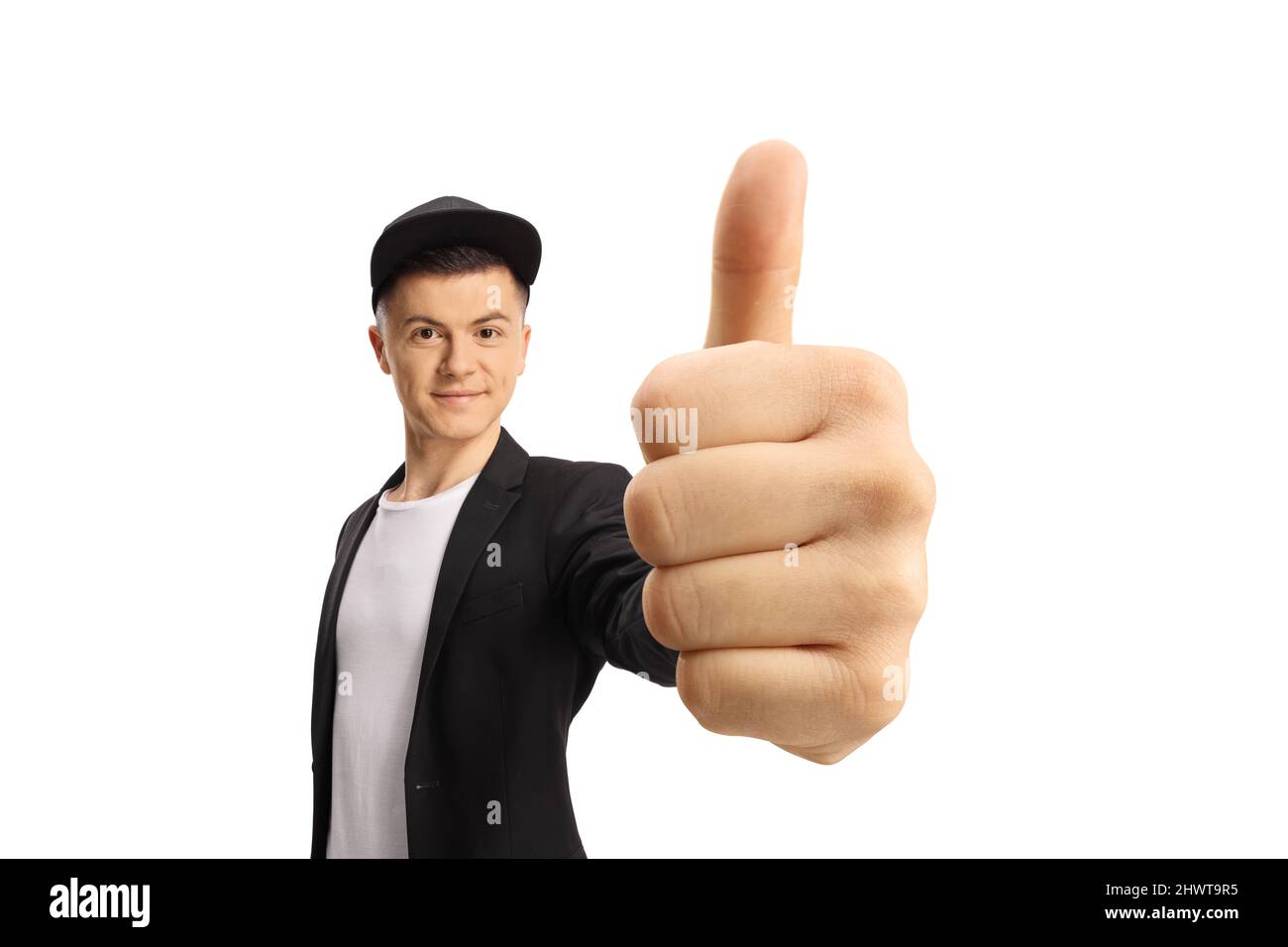 Cheerful fashionable guy showing thumbs up isolated on white background ...