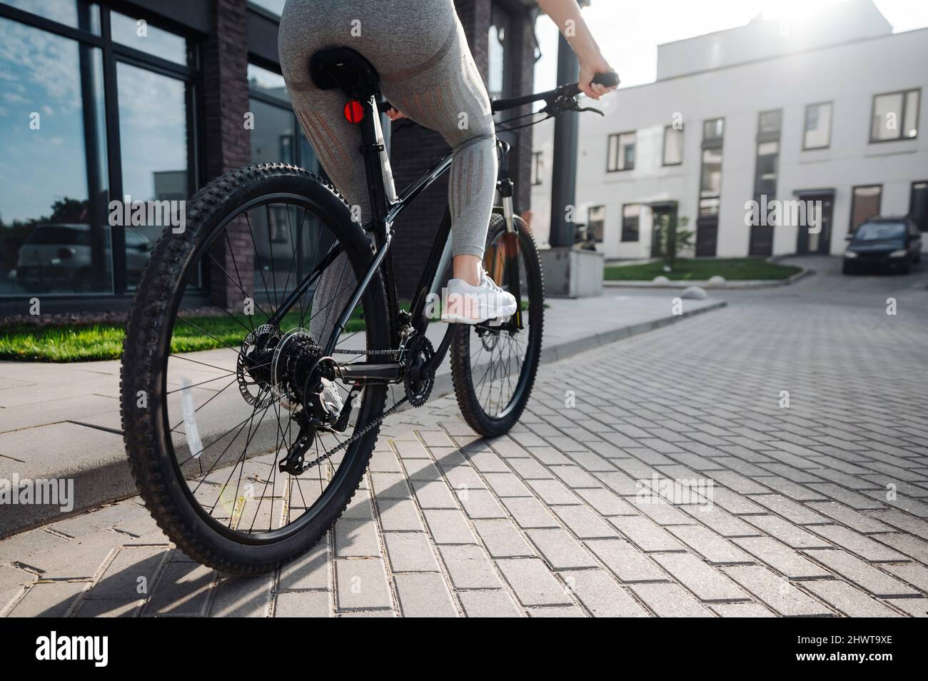 Woman riding bike legs up hi-res stock photography and images - Alamy