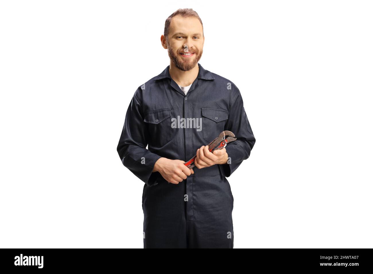 Plumber in a uniform holding pliers isolated on white background Stock ...