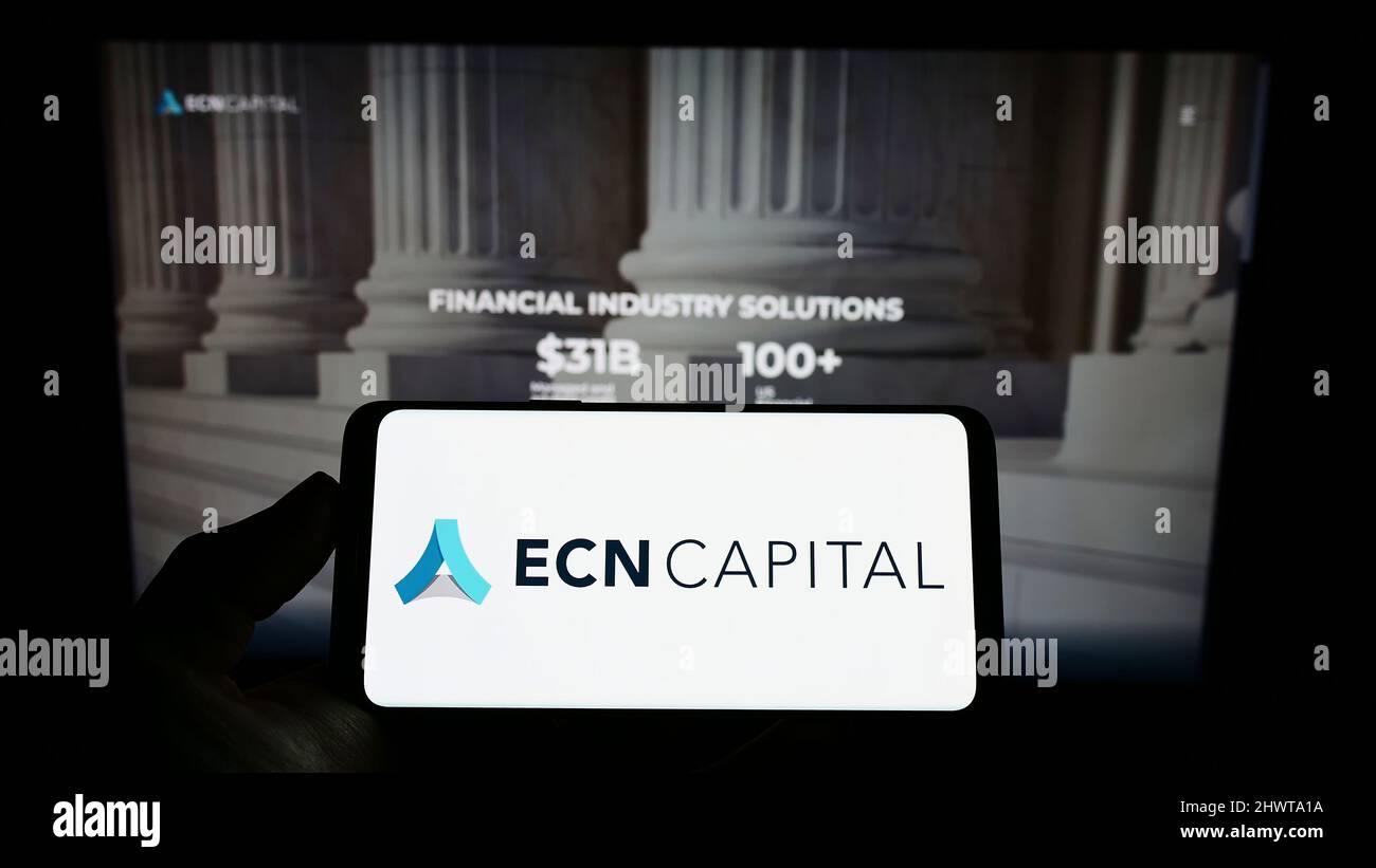 Person holding cellphone with logo of Canadian credit company ECN ...