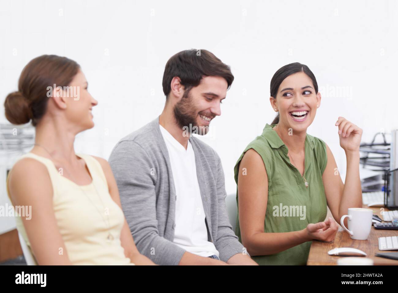Catching up with colleagues. Shot of three work colleagues enjoying a ...