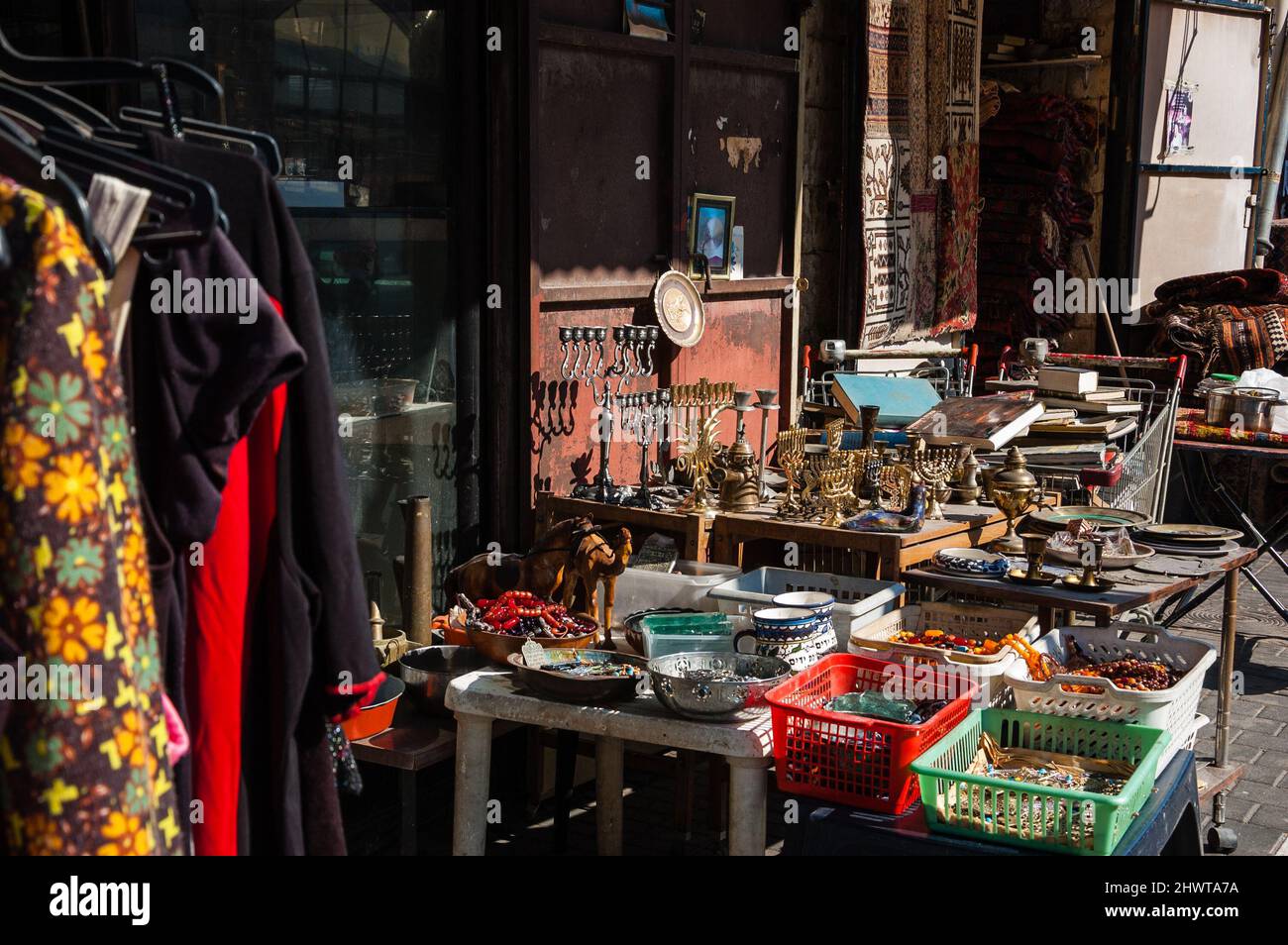 Colorful secondhand vintage clothes, judaica objects and other Israeli ...