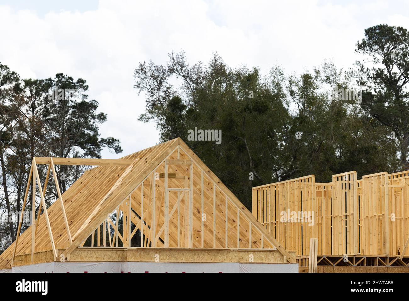 Angled roof ridge area of a new construction house being built Stock ...