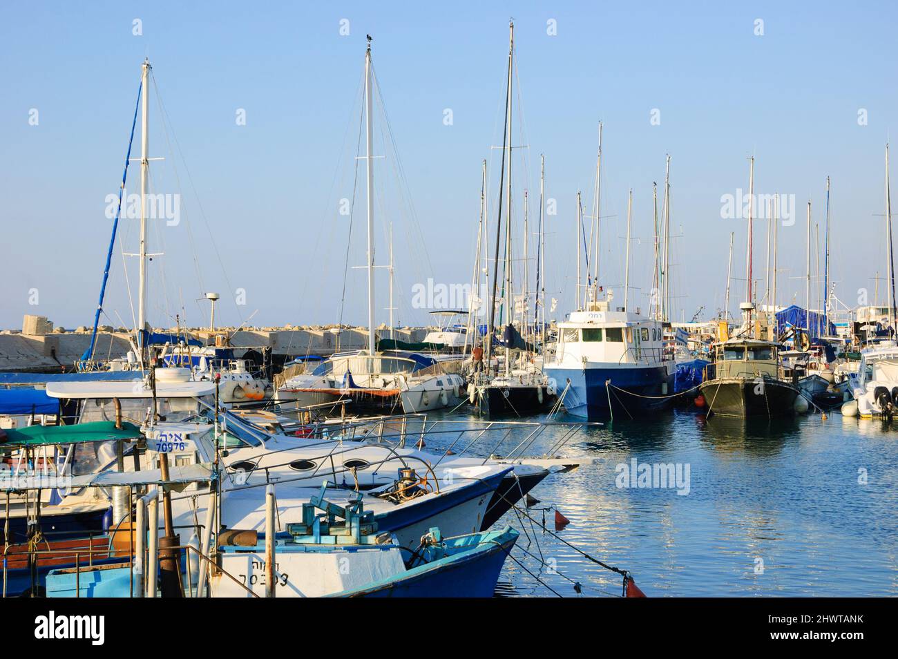 TEL AVIV-YAFO, ISRAEL - FEBRUARY 18, 2014: Plane flying over fishing ...