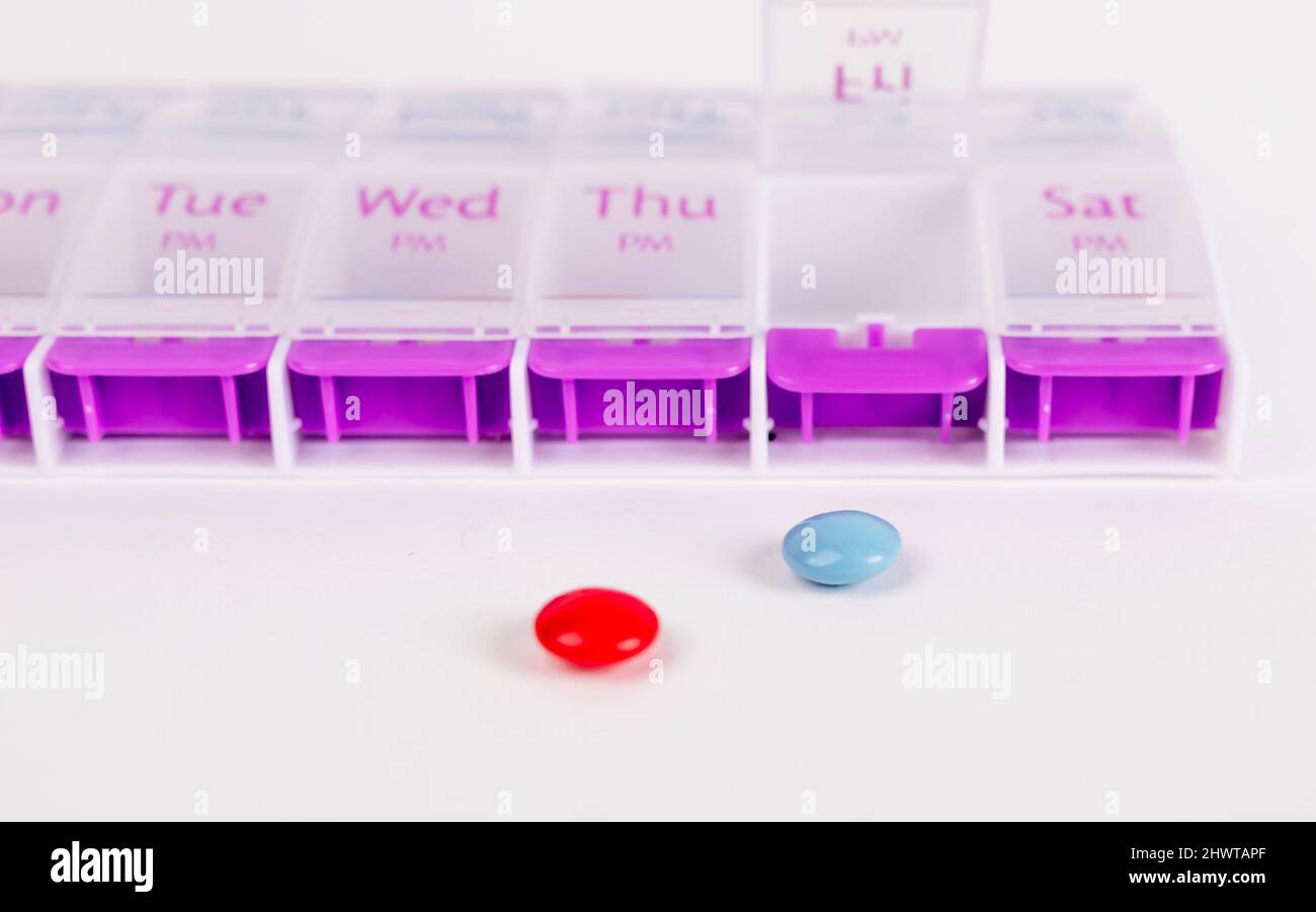 Weekly pills box and tablets or vitamins. Health care and medical ...