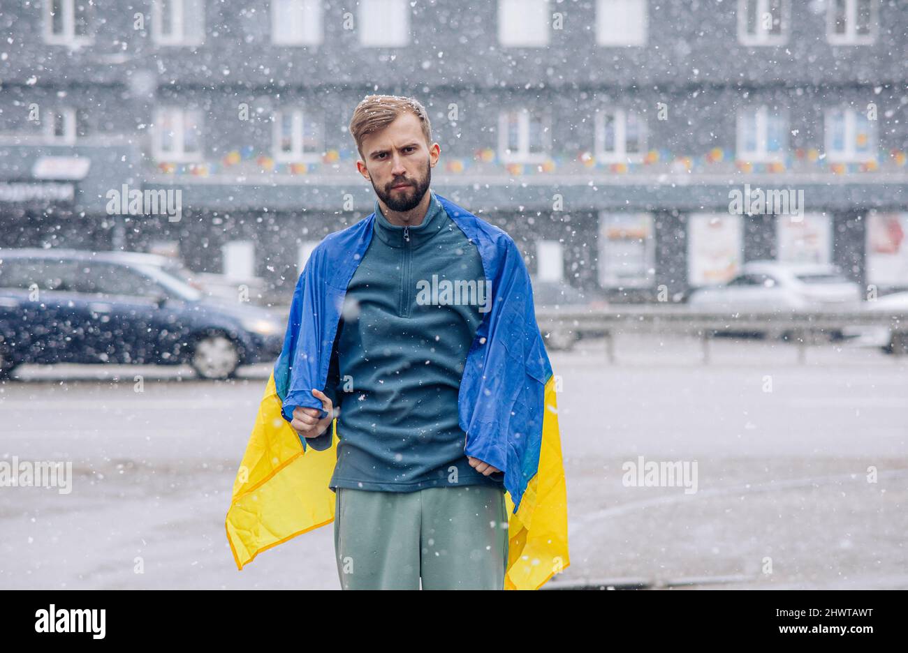 Young angry man wrapped in ukrainian flag protests against Russia ...
