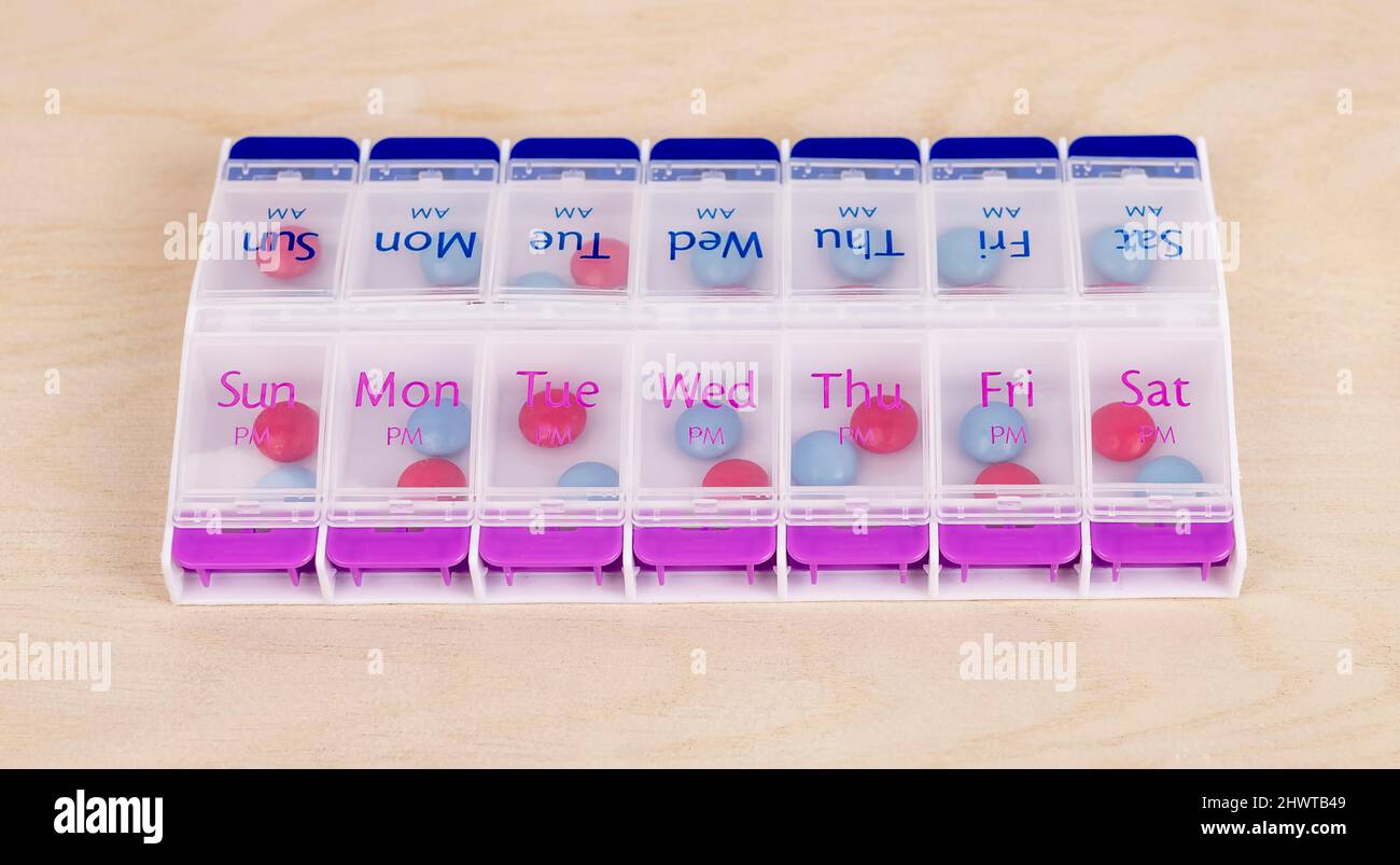 Weekly pills box. Container for tablets and vitamins storage. Reminder ...