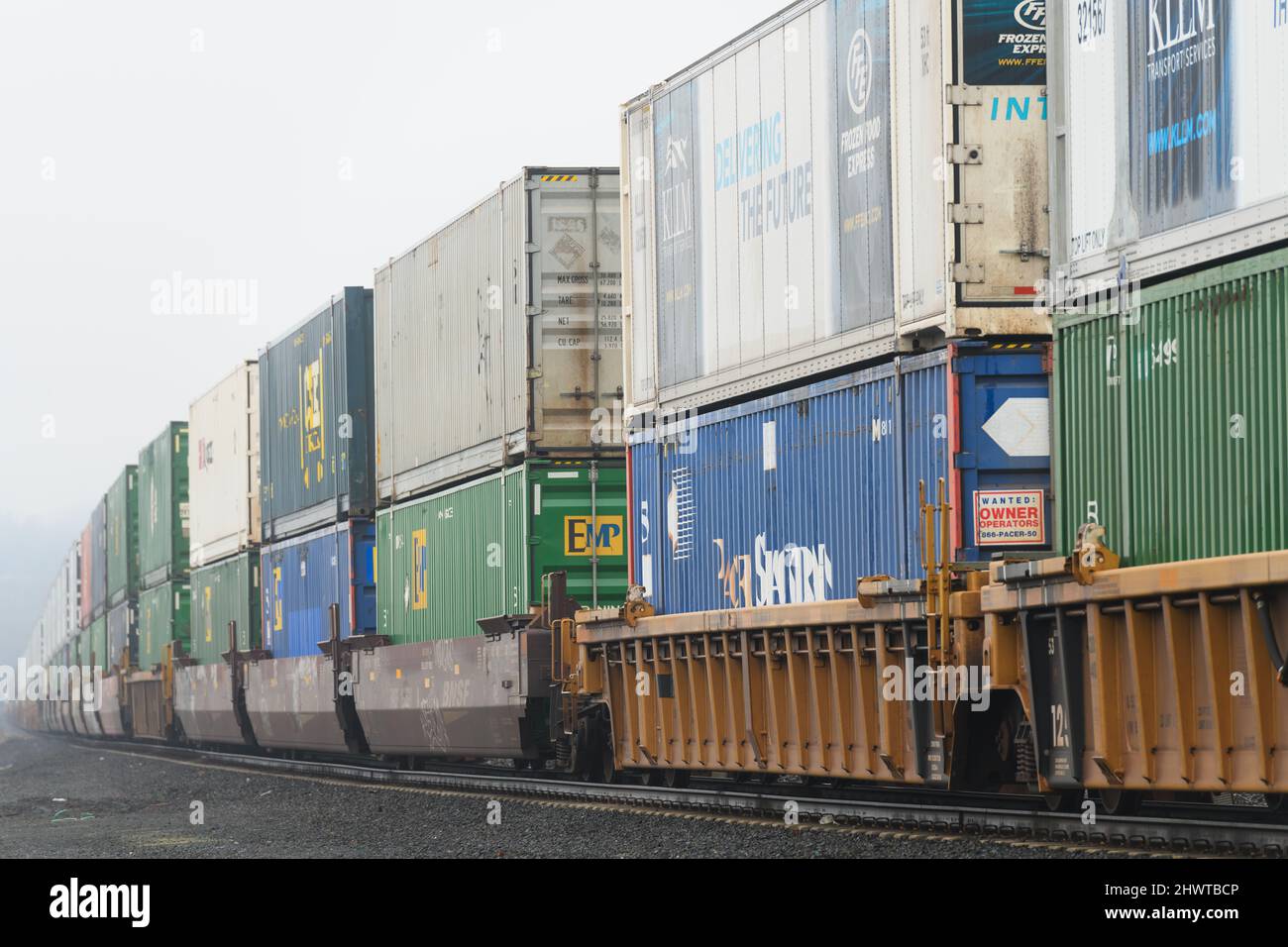 Seattle, WA, USA - March 06, 2022; Intermodal container train passing ...