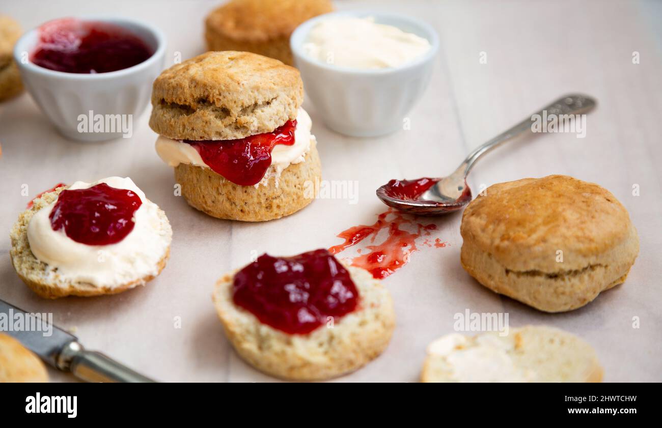 Traditional british scones with clotted cream and strawberry jam for ...