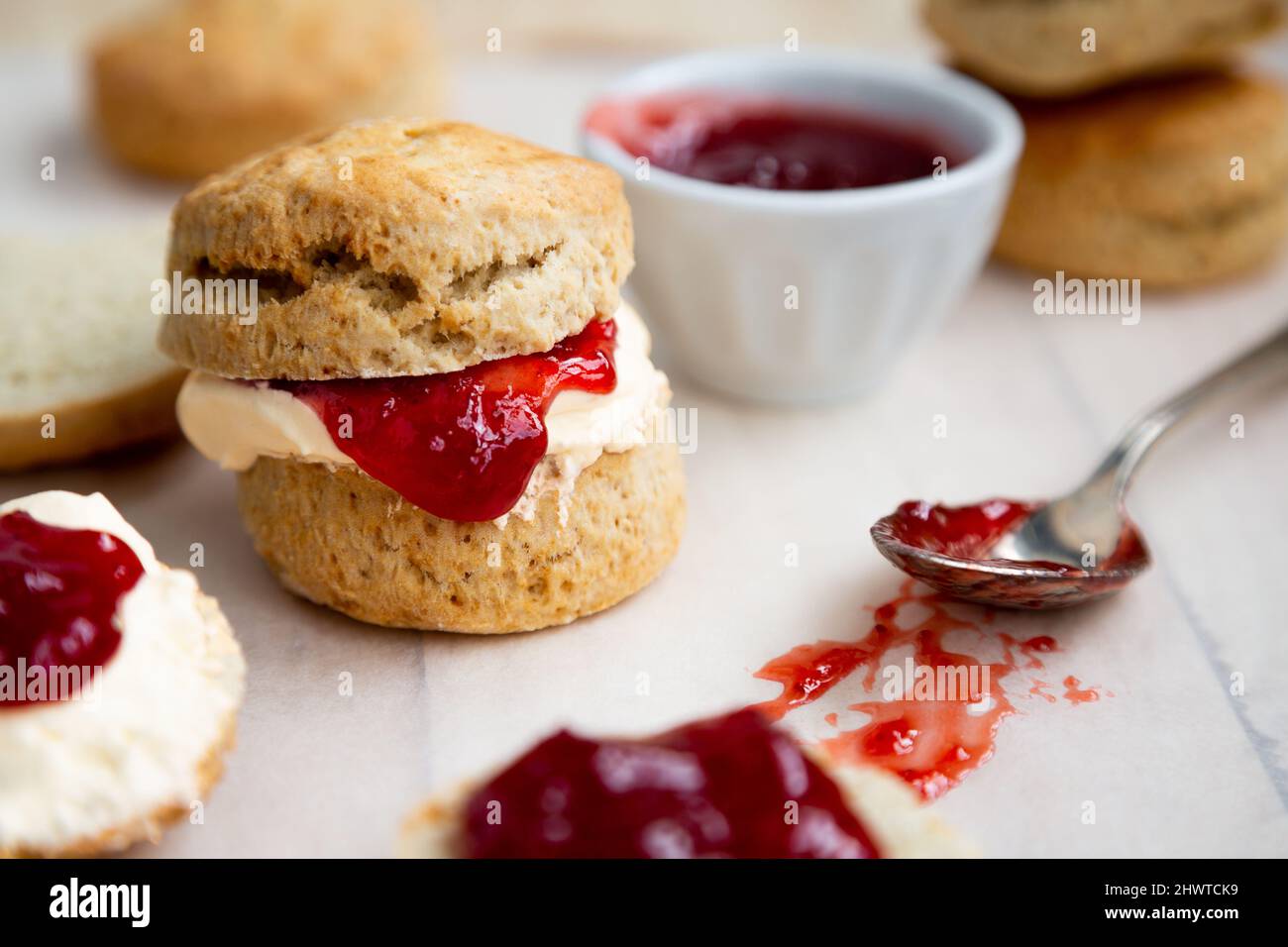 Traditional british scones with clotted cream and strawberry jam for ...