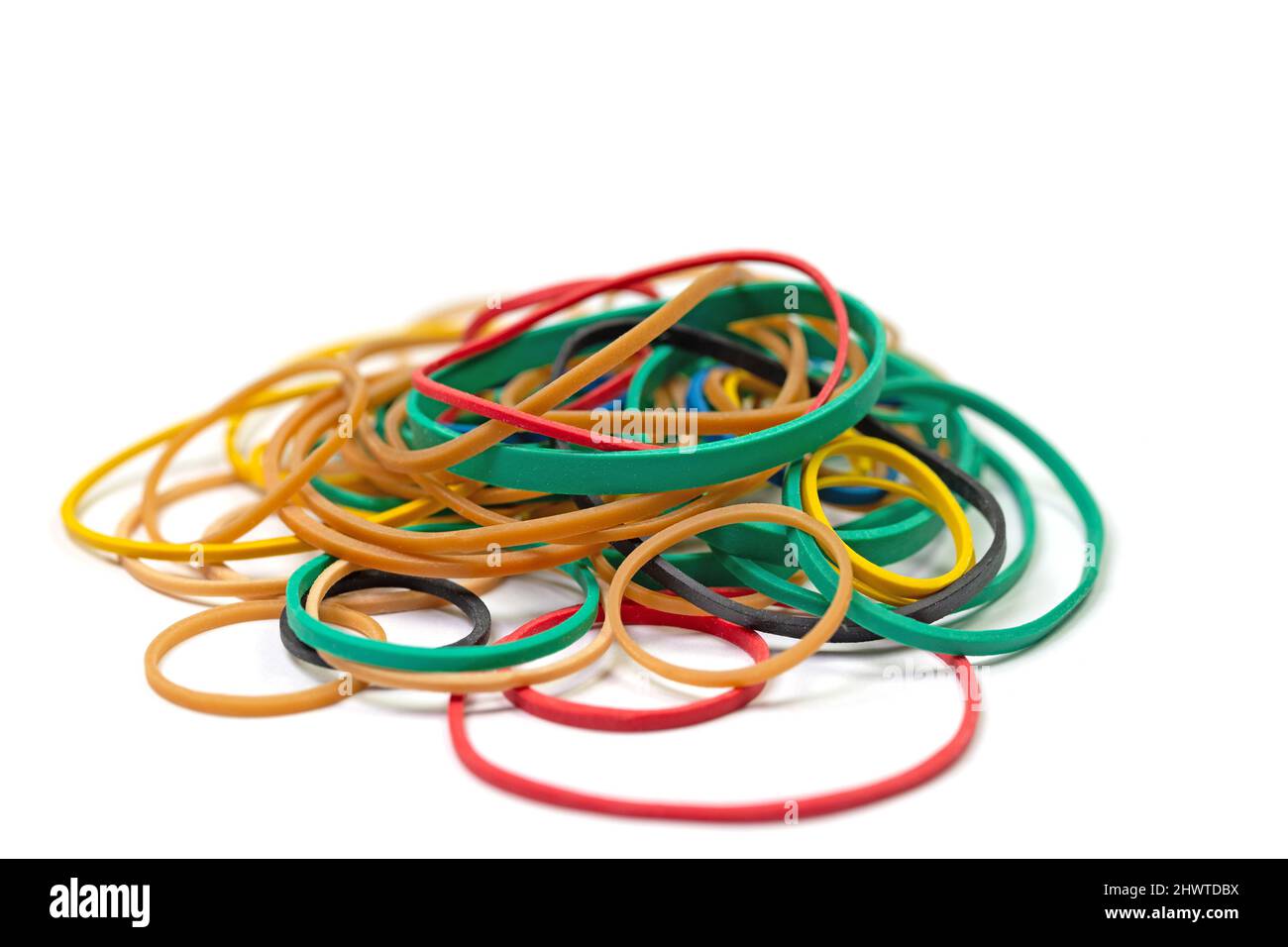 Many colorful rubber rings against a white background Stock Photo - Alamy