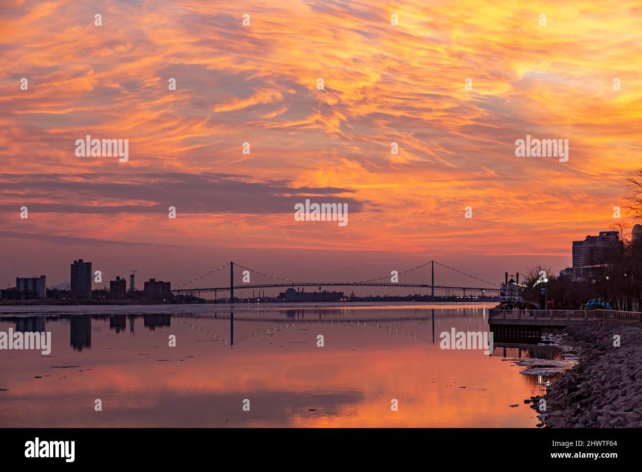 Detroit, Michigan - The Detroit River and Ambassador Bridge at sunset ...