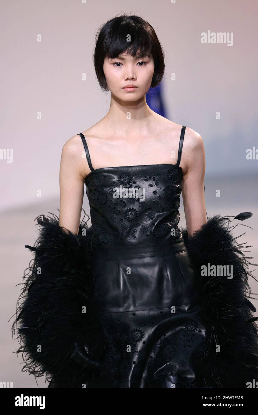 A model walks on the runway of a fashion show in Paris, France, and ...