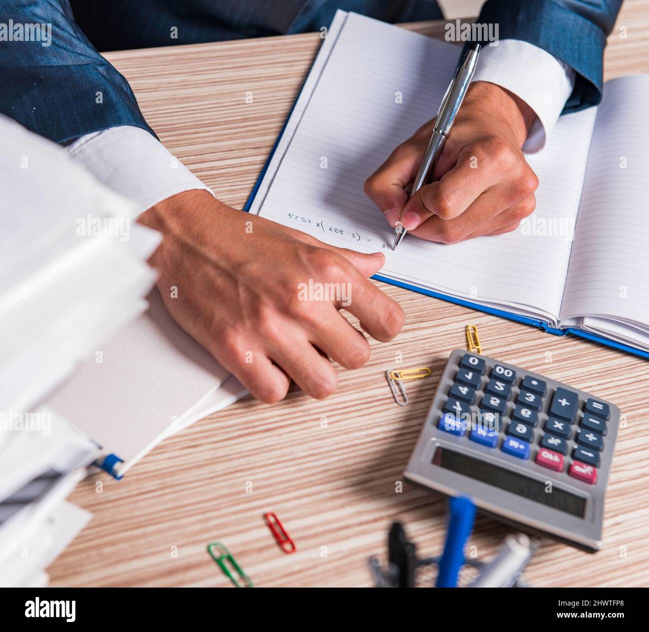 The businessman writing report in the office Stock Photo - Alamy