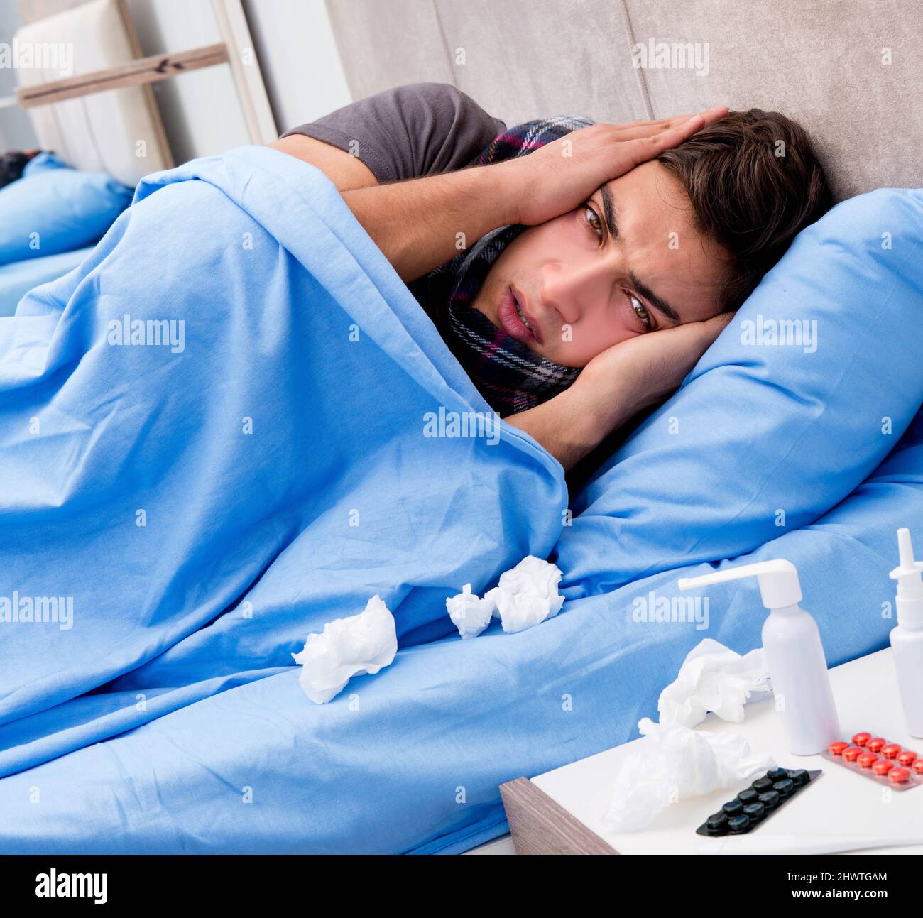 The sick ill man in the bed taking medicines and drugs Stock Photo - Alamy