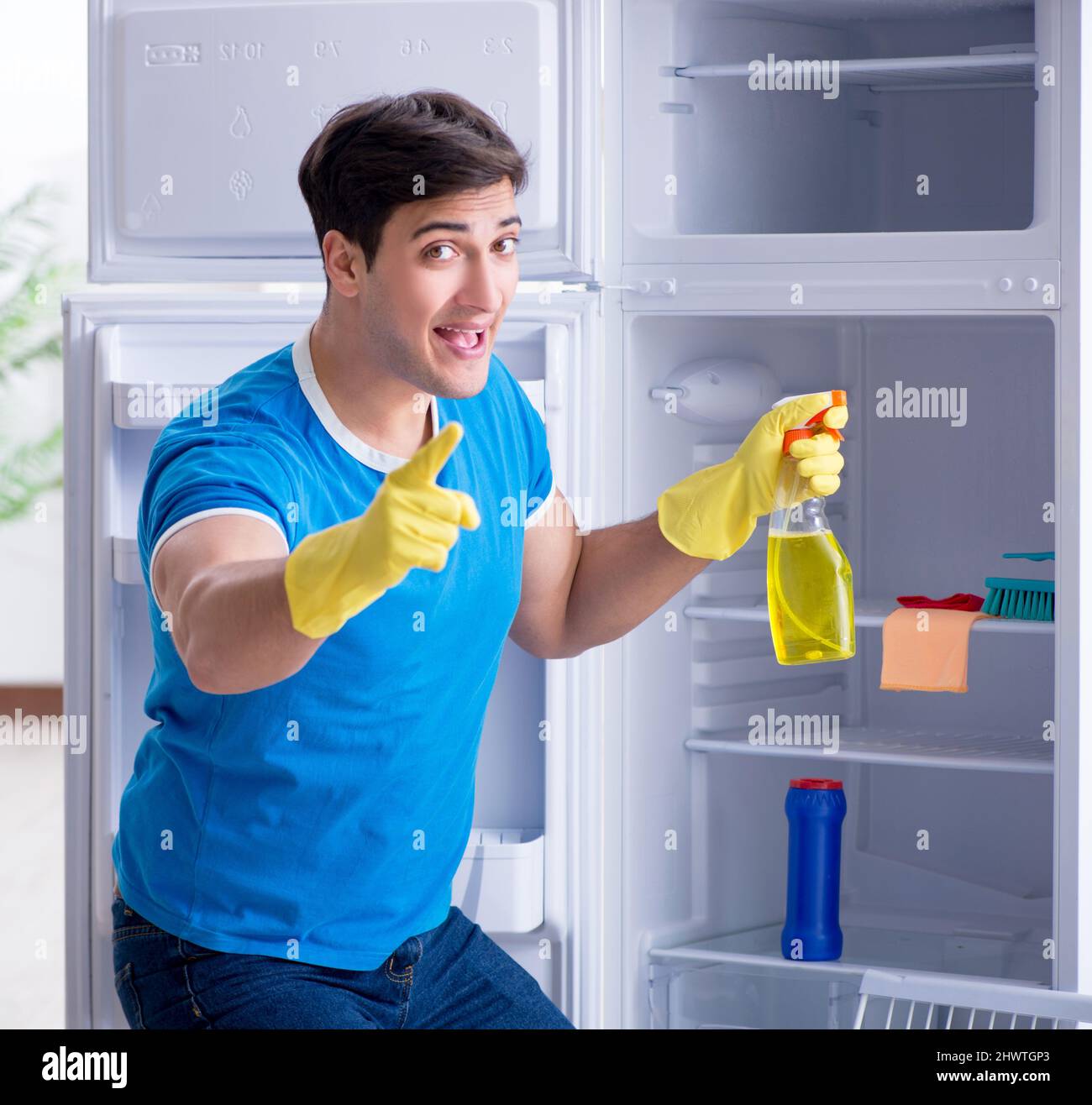 The man cleaning fridge in hygiene concept Stock Photo - Alamy