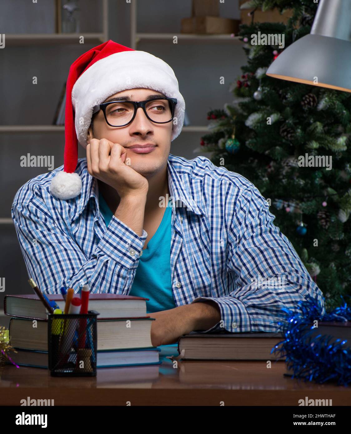 The young man working at home on christmas day Stock Photo - Alamy