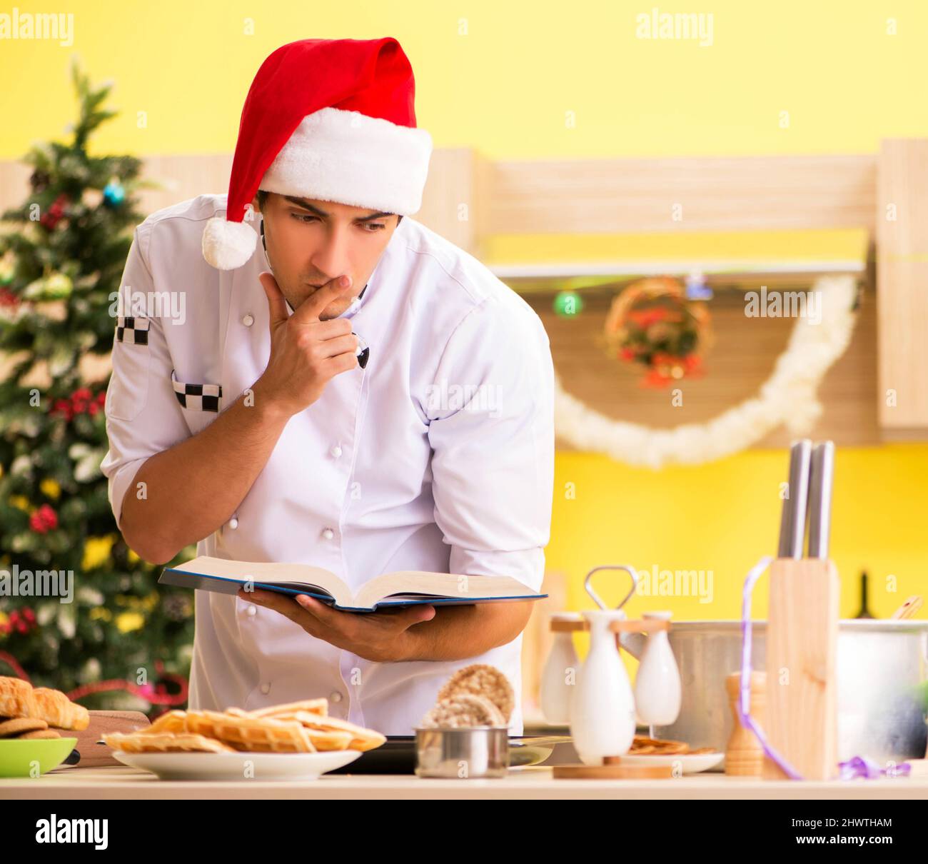 The young chef husband working in kitchen at christmas eve Stock Photo ...