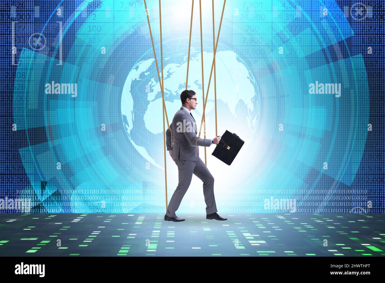 Businessman puppet being manipulated by the ropes Stock Photo - Alamy