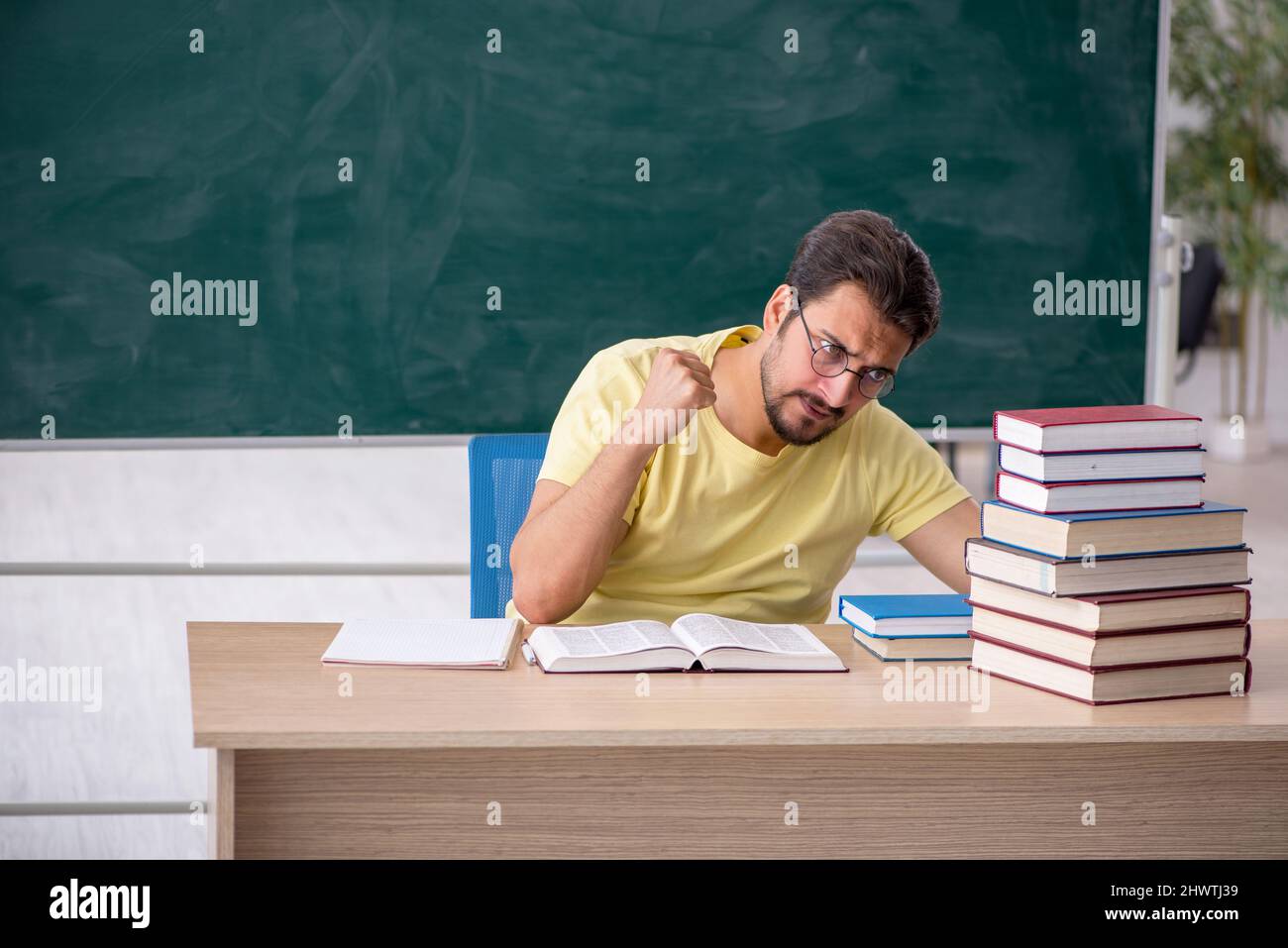 Angry teacher hitting student hi-res stock photography and images - Alamy