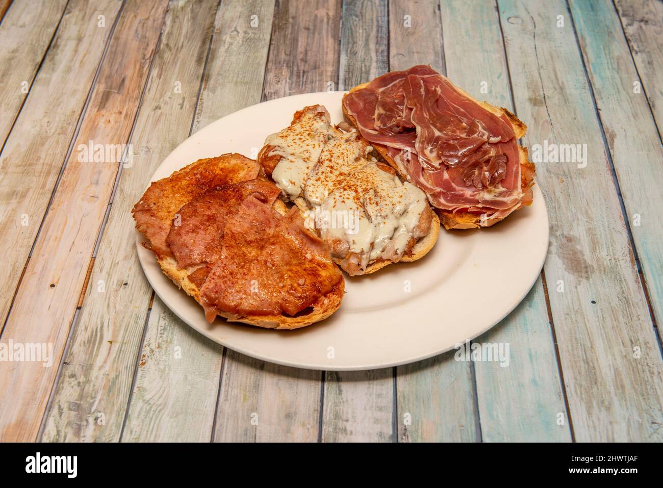 Assorted Spanish toasts with Serrano ham with olive oil, another with ...