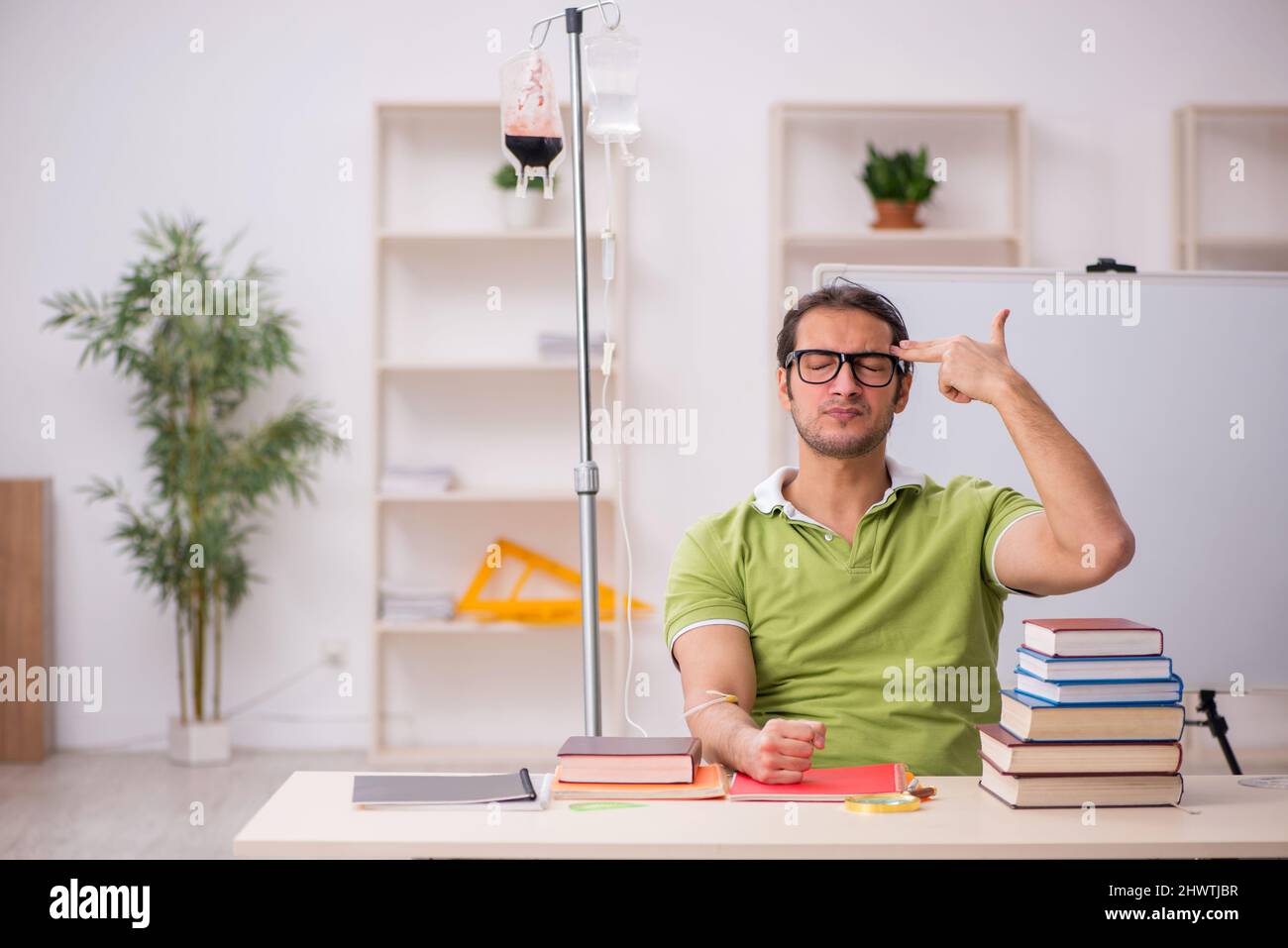 Young sick teacher student in blood transfusion concept Stock Photo - Alamy