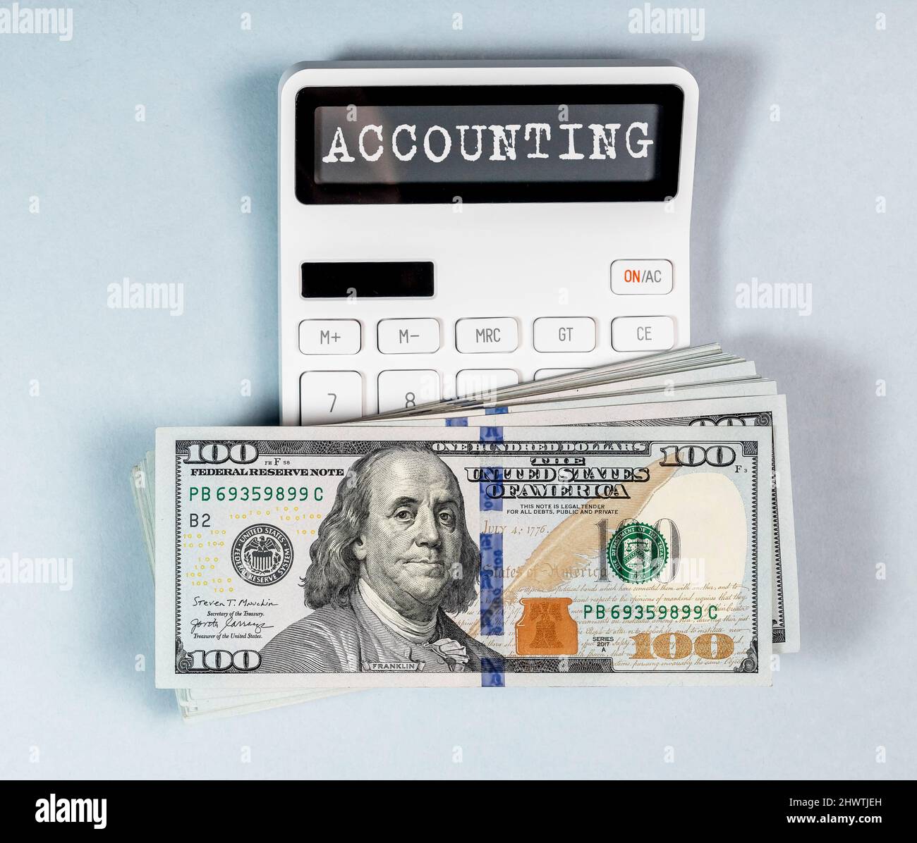 Accounting word. Accountant with calculator for business taxes and ...