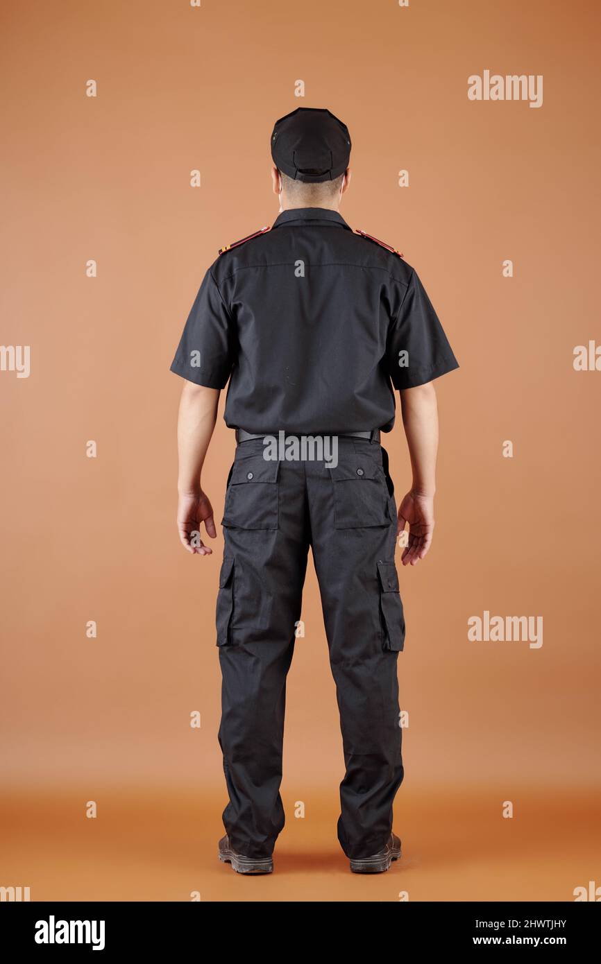 Armed man from back in uniform hi-res stock photography and images - Alamy