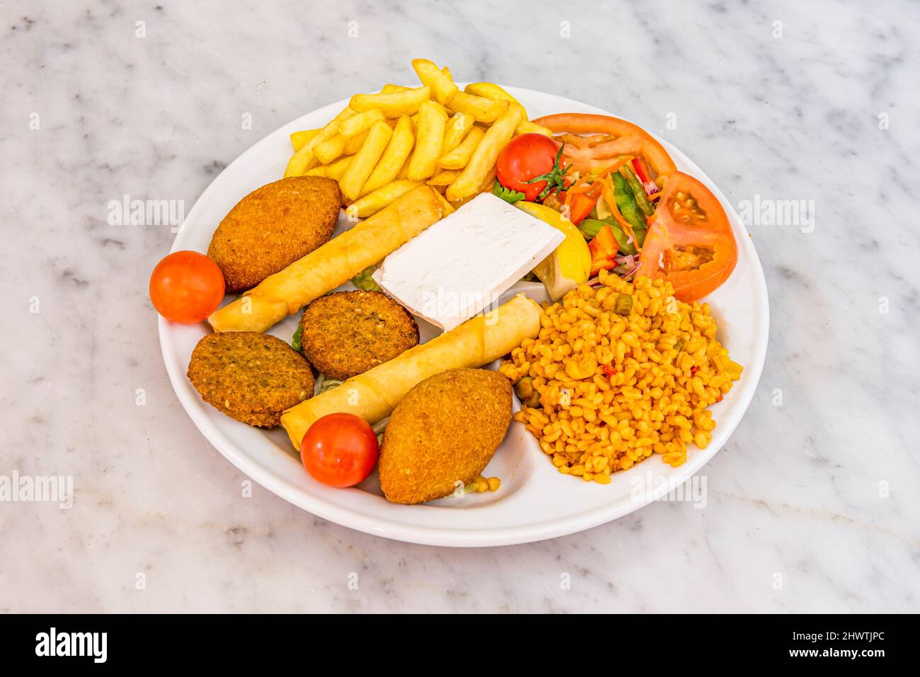 Turkish traditional menu plate with falafel, croquettes, cheese strips ...