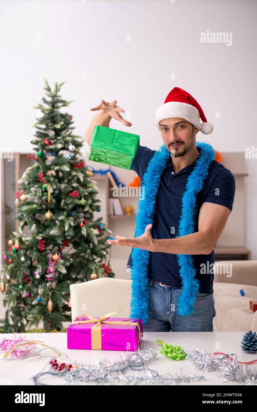 Young man celebrating New year at home alone Stock Photo - Alamy
