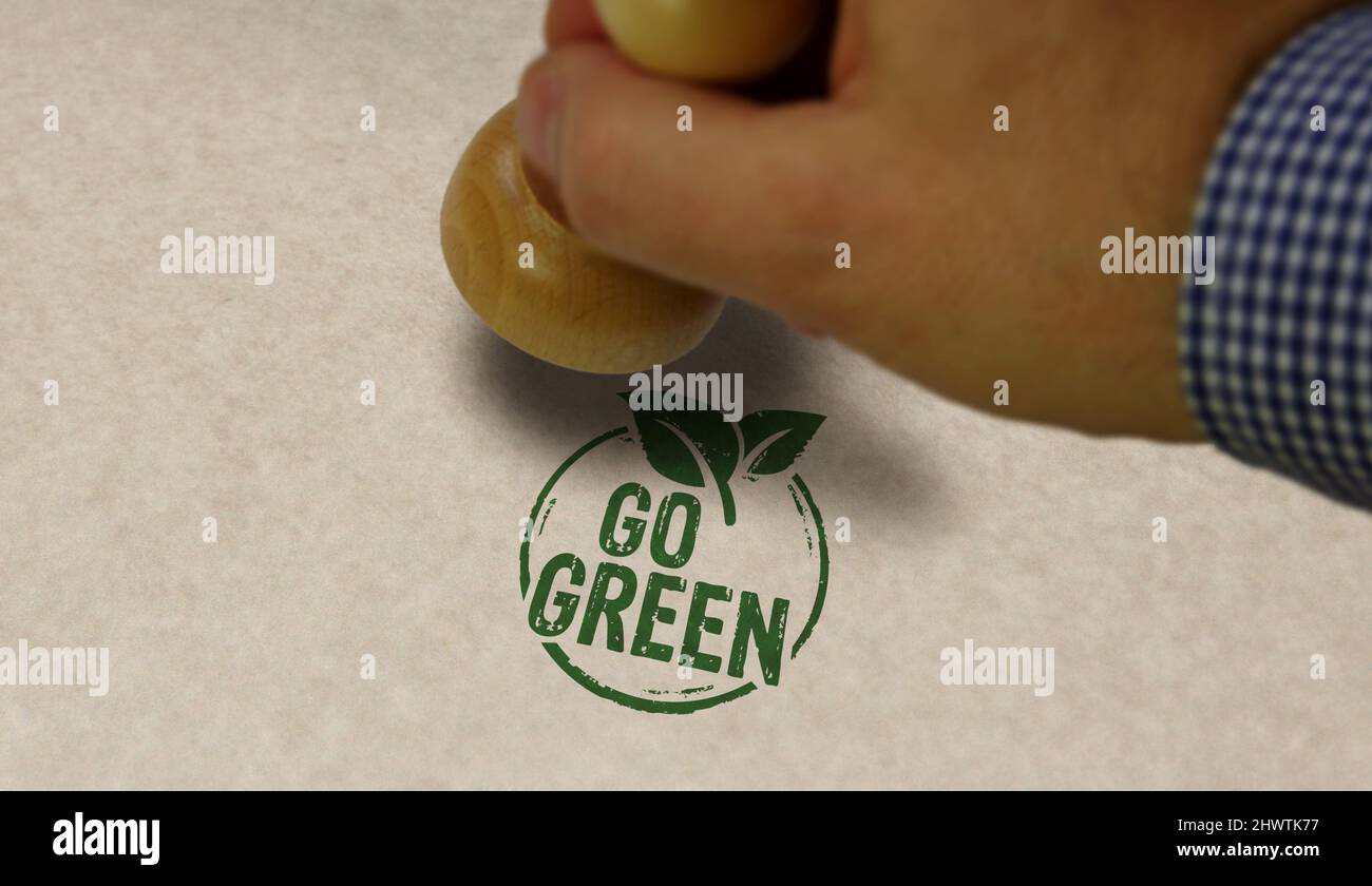 Go green and eco friendly symbol stamp and stamping hand. Co2 neutral ...