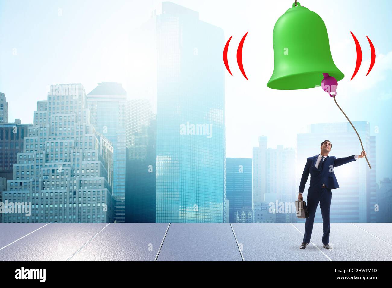 Businessman ringing the bell in case of the danger Stock Photo - Alamy