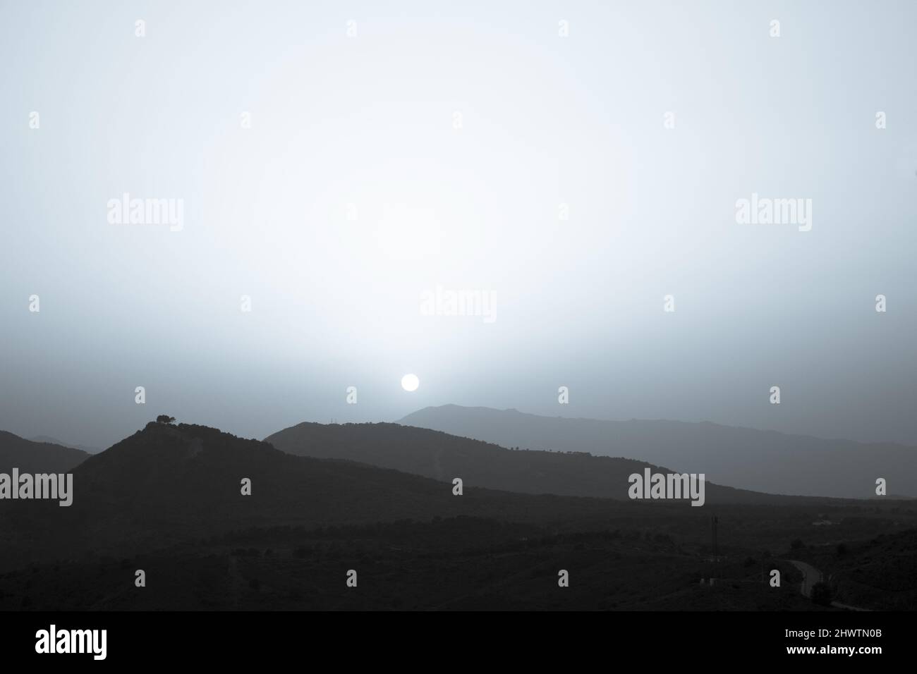 Sunset in the mountains with the sun. No people Stock Photo - Alamy
