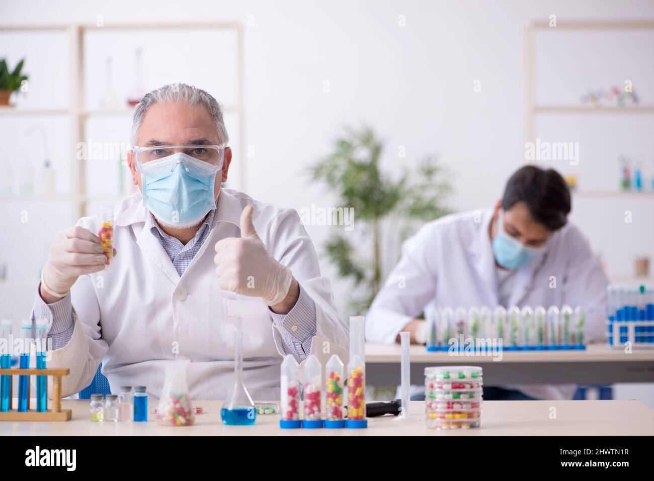 Two chemists in drugs synthesis concept at the lab Stock Photo - Alamy