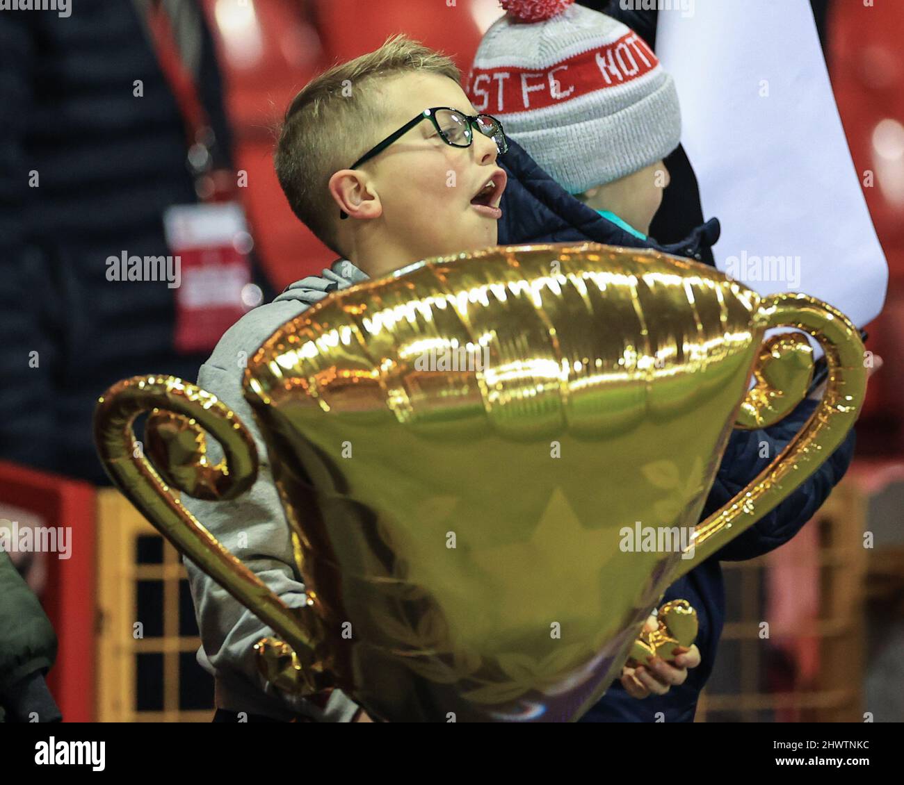 A young Nottingham Forest fan with a balloon shaped cup Stock Photo - Alamy
