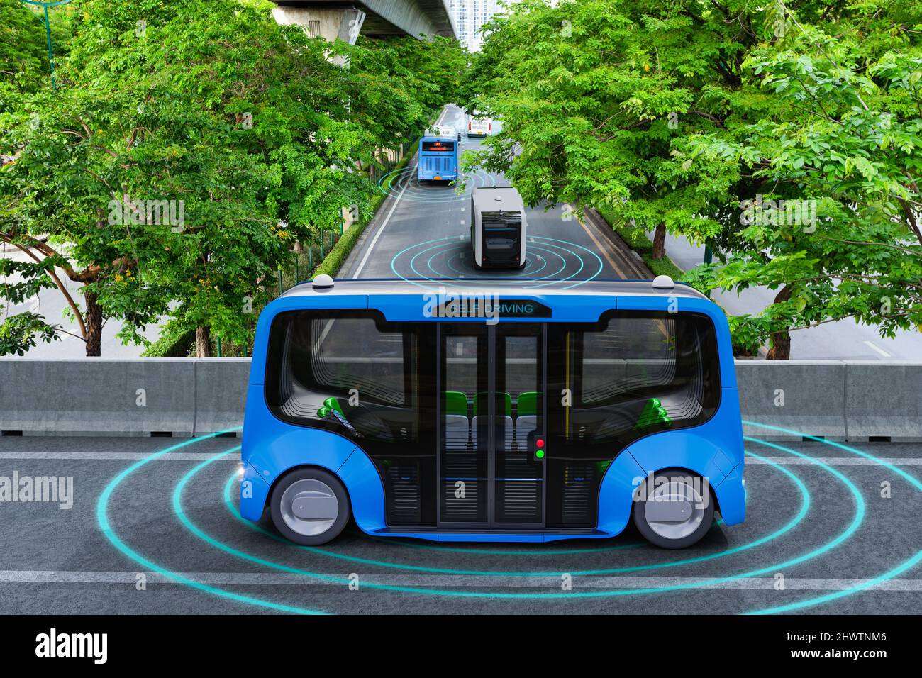 Autonomous electric shuttle bus self driving across city green road ...