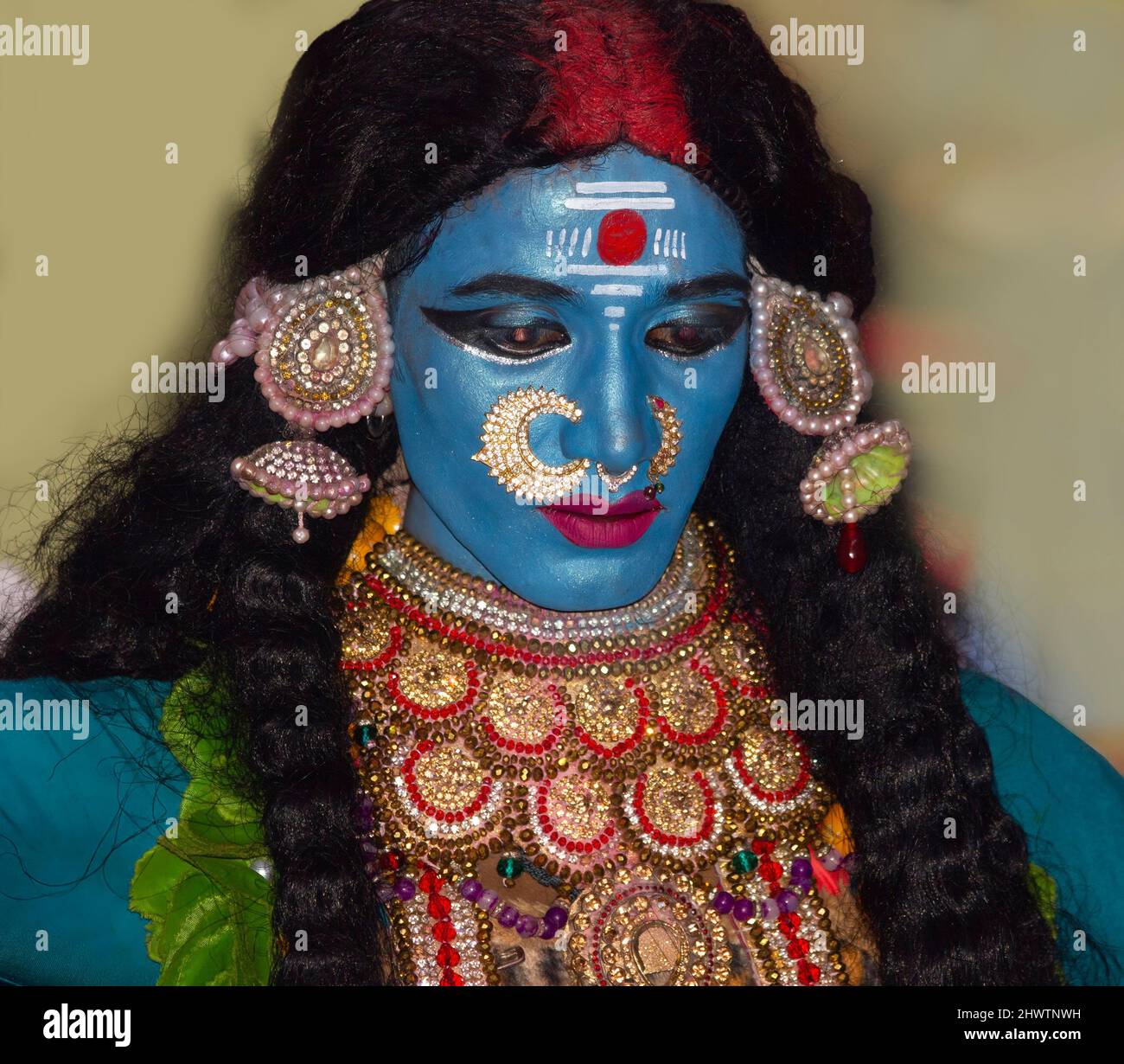 A drama artist in the attire of Indian Goddess during a performance at ...