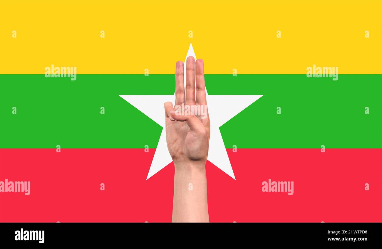 The three finger of Myanmar man raised as a protest sign with Myanmar ...